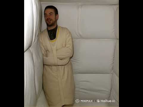 Young man wearing a straitjacket in a padded cell #straitjacket