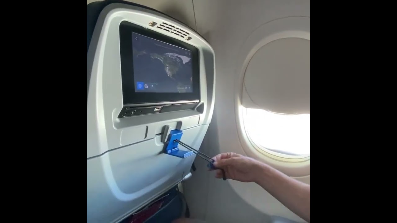 In-Flight hands-free SkyClip+ phone and tablet holder with a reader.