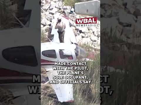 Small plane slides from runway onto shoreline near Bay Bridge Airport