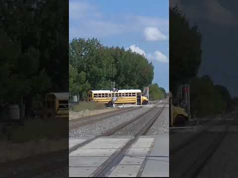 School Bus knocks railroad crossing gate off