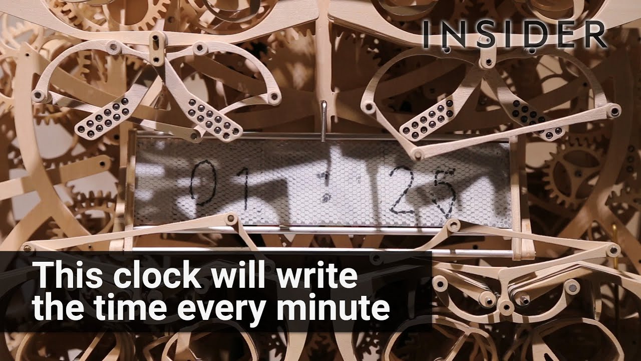 This clock writes the time