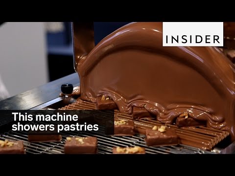 This machine showers pastries in chocolate