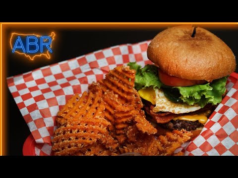 Must Try Burger is STACKED - Shaw's Patio Bar & Grill