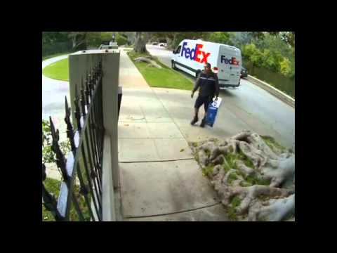 FedEx Guy Throwing Computer Monitor Over Fence