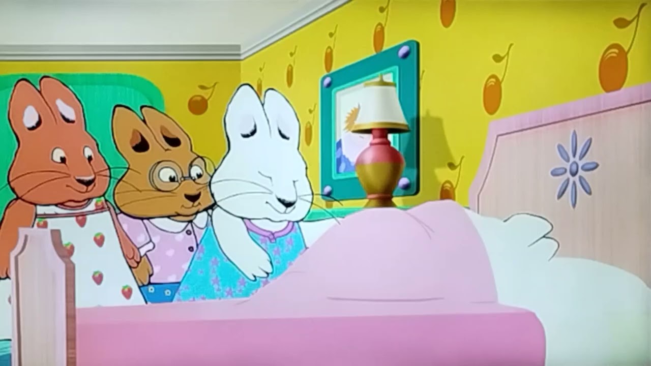 Max is sleeping on Ruby's bed