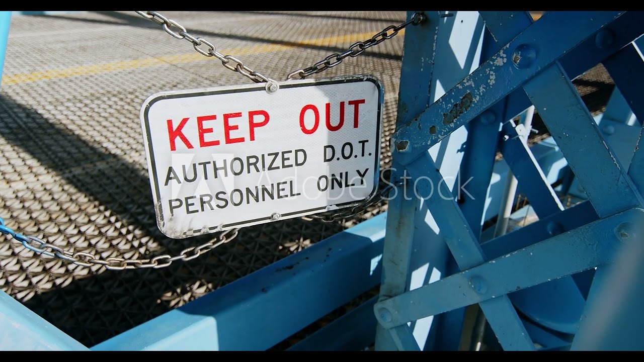 Video Stock 4K – Keep out warning sign dangling on the bridge danger on construction work site