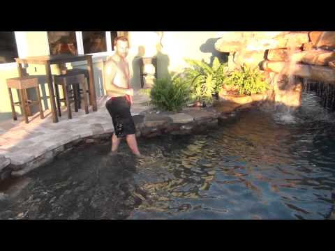 Swim with Lucas in a Pool and Spa Remodel with Natural Stone Waterfalls in Bradenton, FL