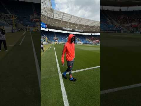 Michael Olise checking the pitch for Hoffenheim vs Bayern, last Bundesliga matchday