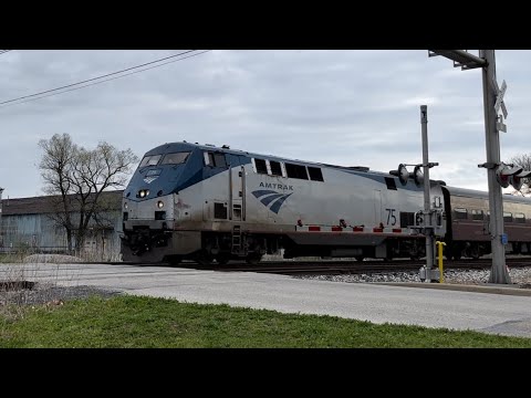 P051-21 w/ AMTK 75 pulls FRA car (DOTX 221) through Rensselaer, Indiana