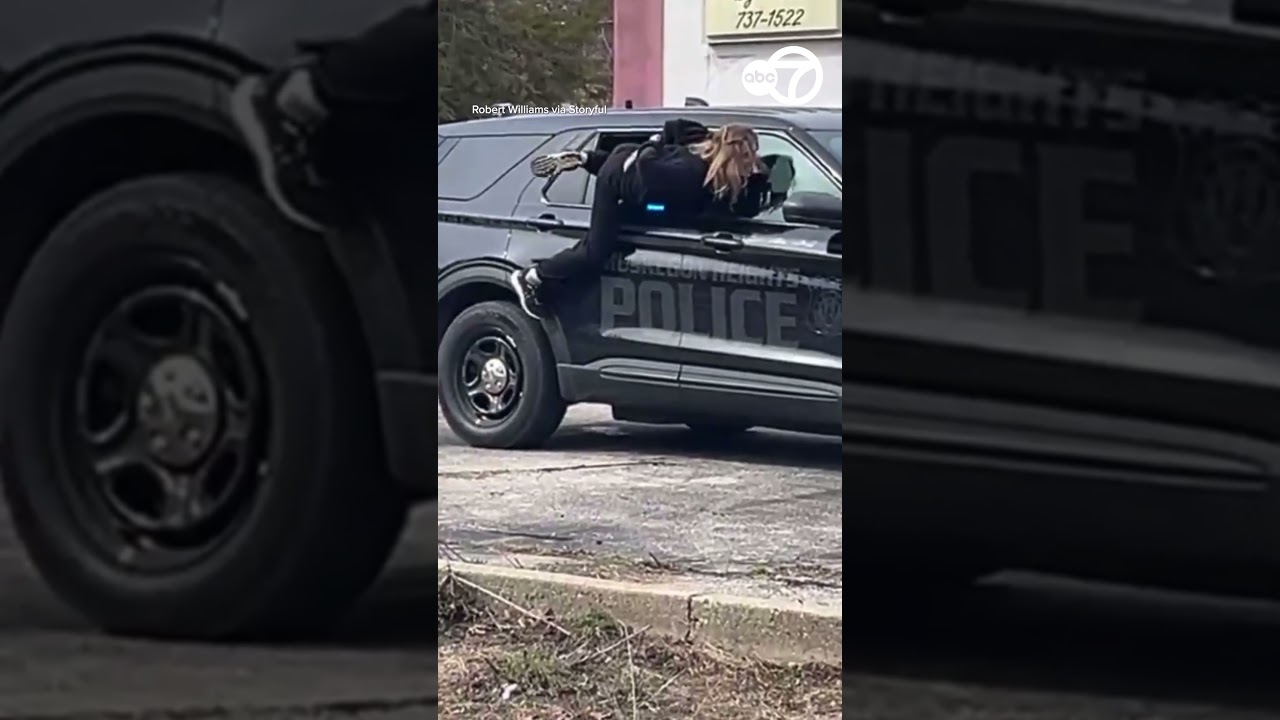 Woman wiggles out of Police custody through car window in Michigan