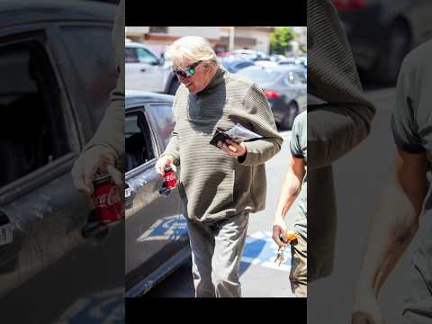 Hollywood star Gary busey stares down photographers as he urinates in the streetGary Busey caused a
