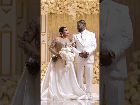 This wedding had it all: lit party, all white guest attire, pant suit reveal, & THE Kenny Lattimore