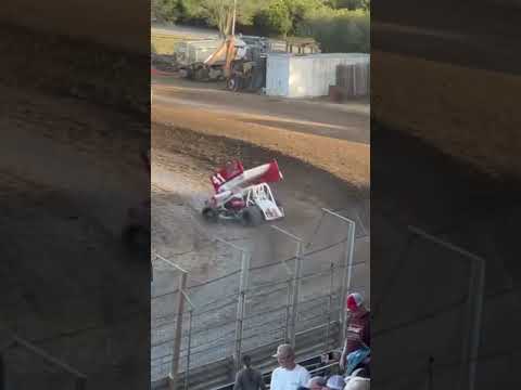 The world of outlaws sprint cars ripping around turn 1