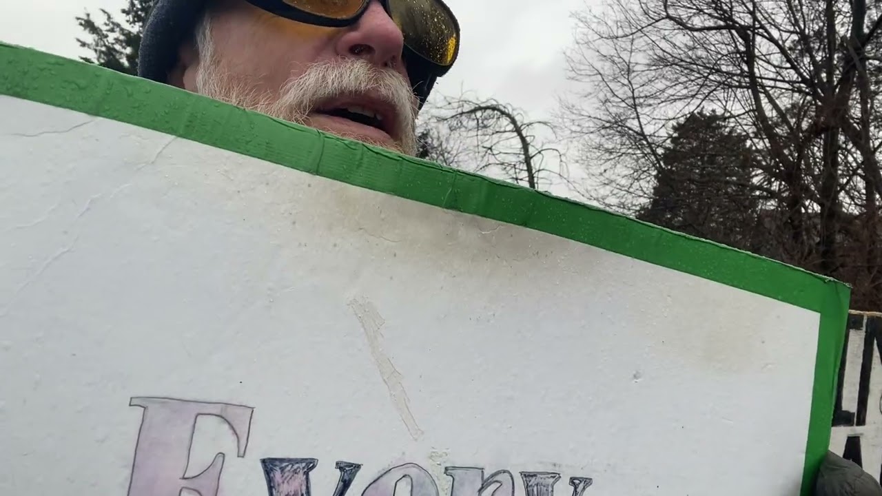 Man With Sign, April 2, 02026