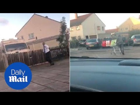 Security guard chases man pushing shopping trolley full of TVs