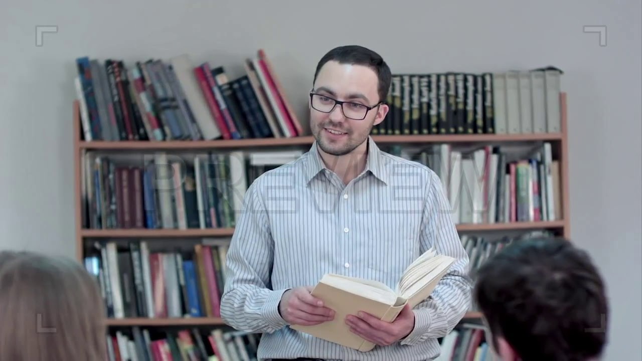Young Teacher With Book Stock Video