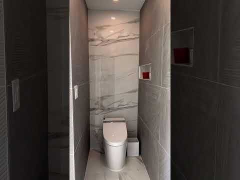 The power of Calacatta Gold marble look tiles #tiles #bathroom #howto #bathroomtile #renovation #diy