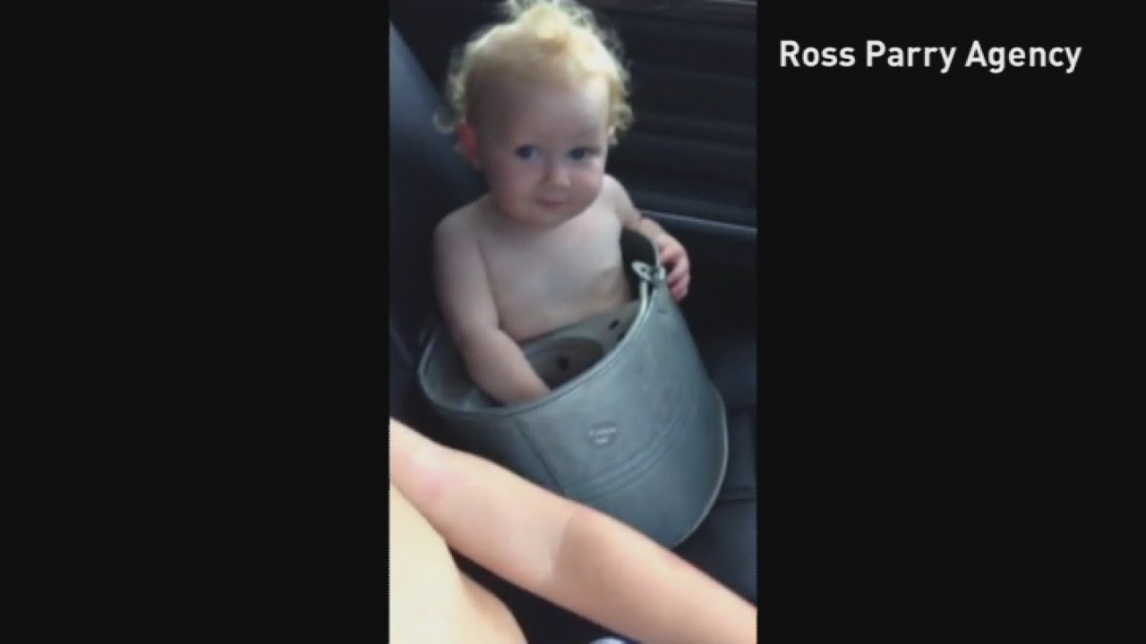 Cute little girl gets rescued after getting stuck in a bucket