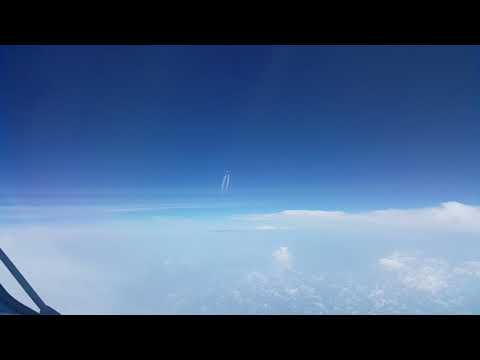 Aircraft passing above opposite direction.