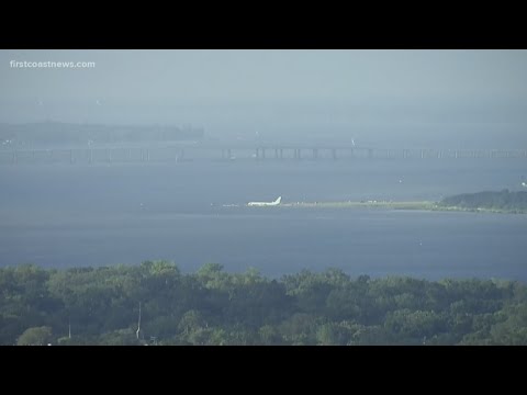 Plane skids into St. Johns River after landing on NAS Jax airport runway