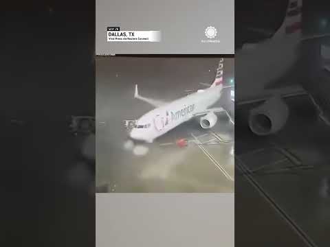 Parked Airplane Blown Away from Terminal at Dallas Airport