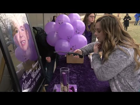 Family of 8-year-old Oliver Hitchcock surrounded by hundreds at vigil