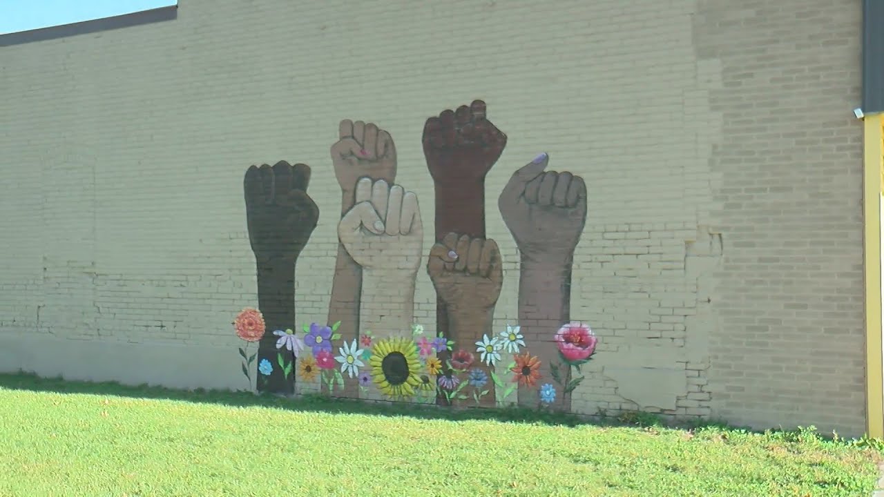 Mural with message of inclusion faces with zoning violation