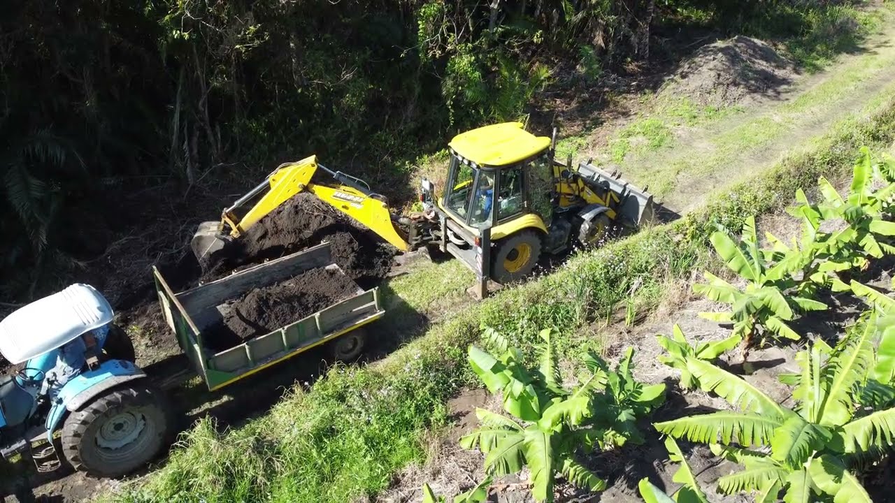 Dezzi 884 TLB Backhoe Loader on a road drainage project