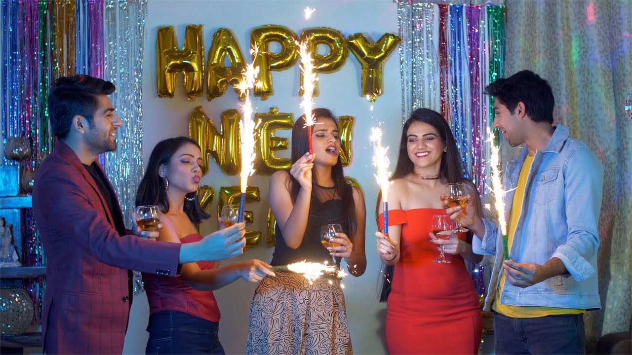 A cheerful group of friends laughing and dancing with sparkler... | Indian Stock Footage | Knot9