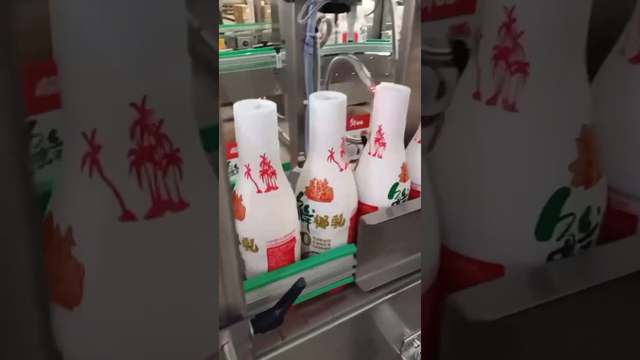 A machine where robots automatically load products into cardboard boxes. Automatic packing machine