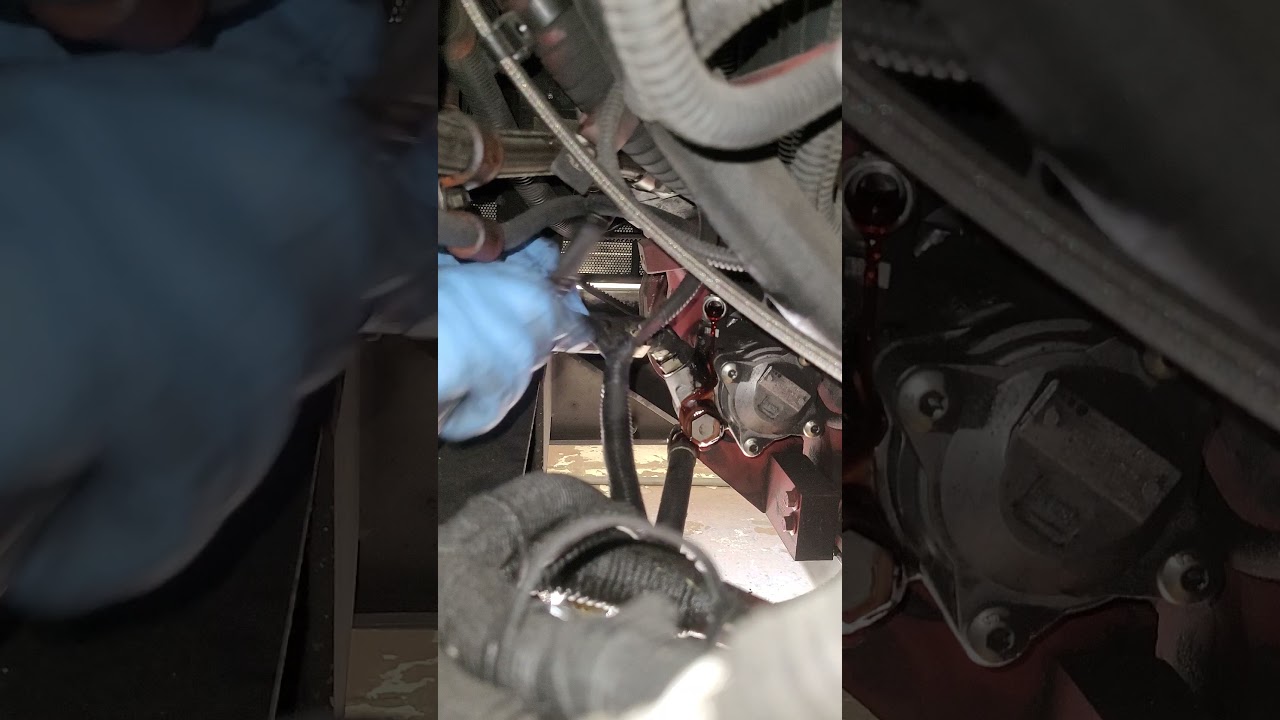 Pulling out power steering pump on a bus.