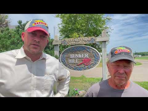 Farmers Jeremy and Steve Bunkers discuss their corn-growing needs.