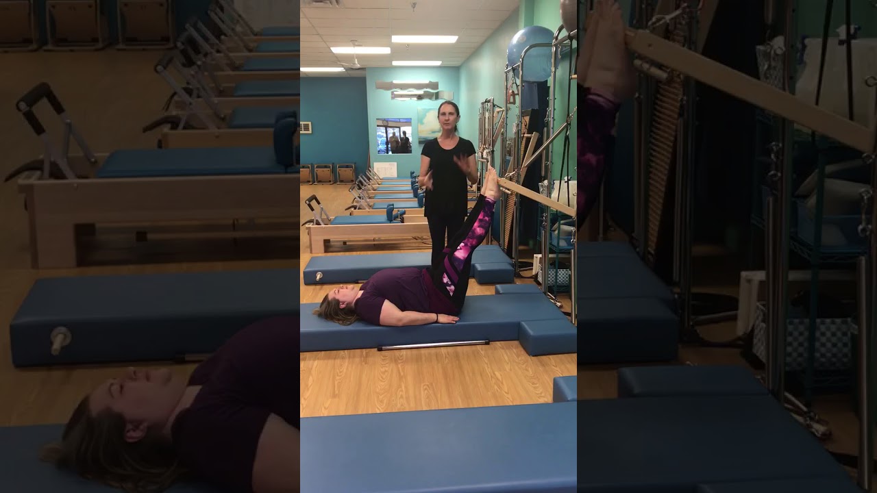 Shoulder Bridge with Push Through Bar - Pilates Tower Exercise