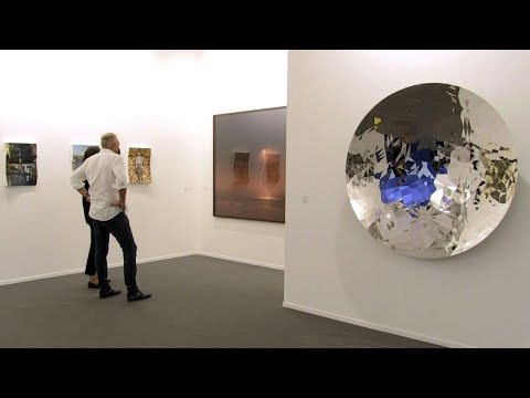 Visitors attend art exhibition at Art Dubai 2021
