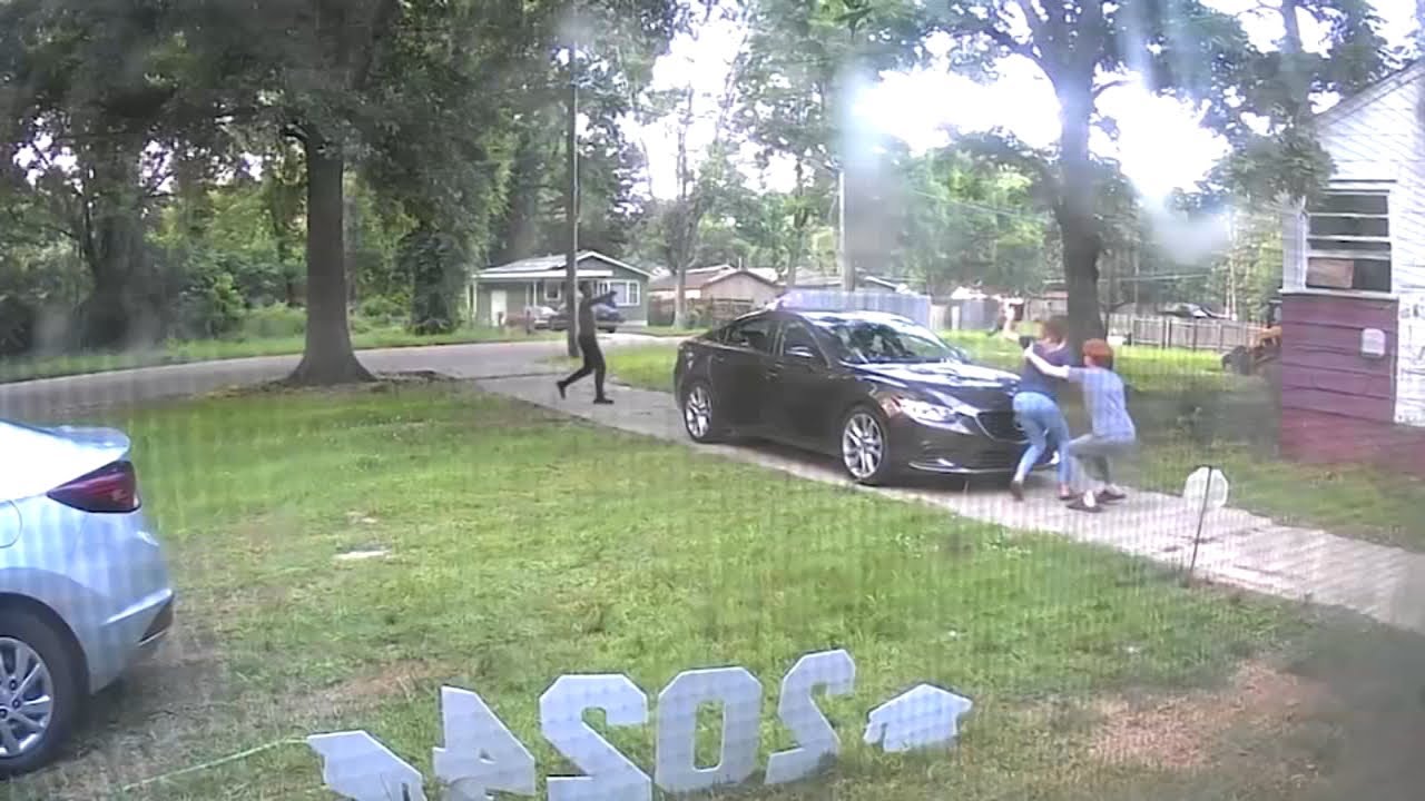 Suspects caught on camera shooting at family during armed carjacking