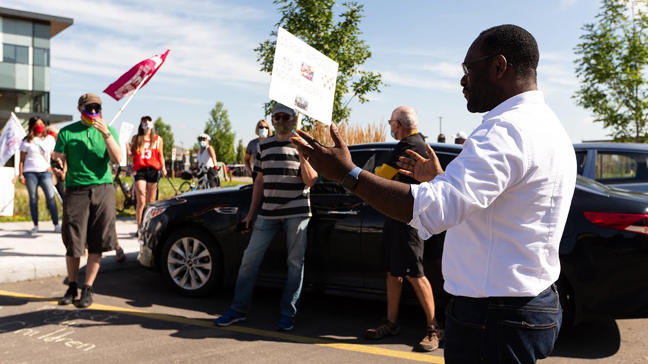 Demonstrators confront MLA Kaycee Madu over Alberta back-to-school plans