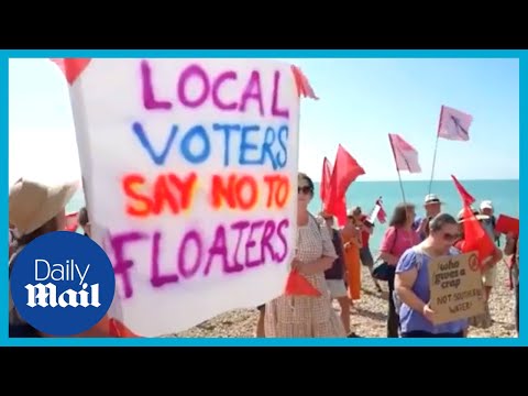 Voters say no to floaters!' Angry protesters take to the beaches to protest sewage release