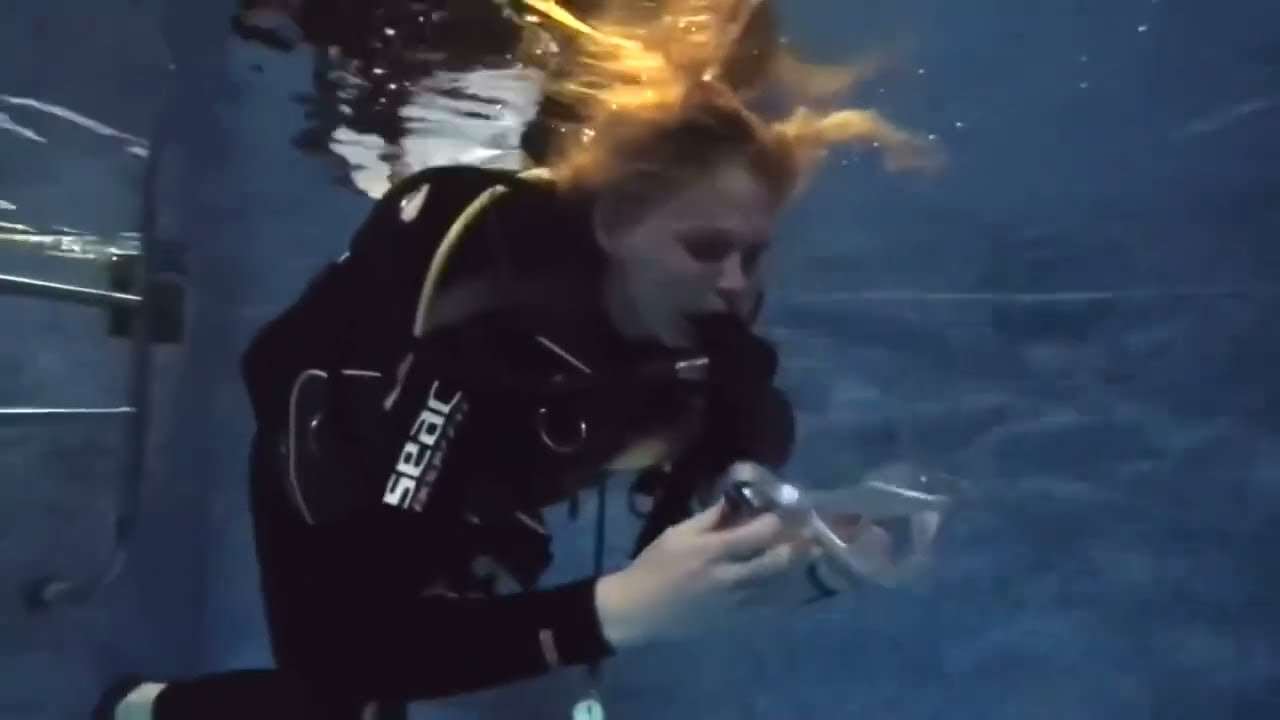 Female Diver is Diving with Seac Neoprene Wetsuit