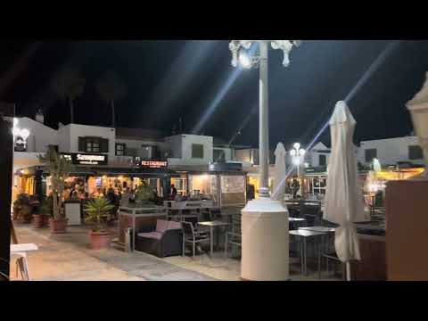 Saxophone bar and square at night. Caleta De Fuste