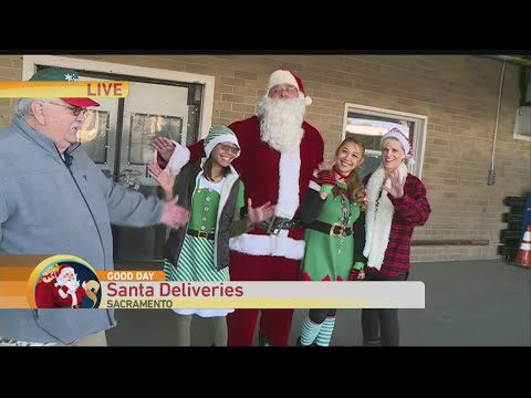 Postal Trucks Deliver Gifts