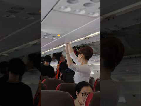 Helping passengers with their cabin baggage, Batik Air's flight attendants always go the extra mile