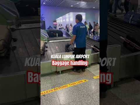 Malaysia Airport Staff - KLIA Airport Baggage Handling at Luggage Claim area