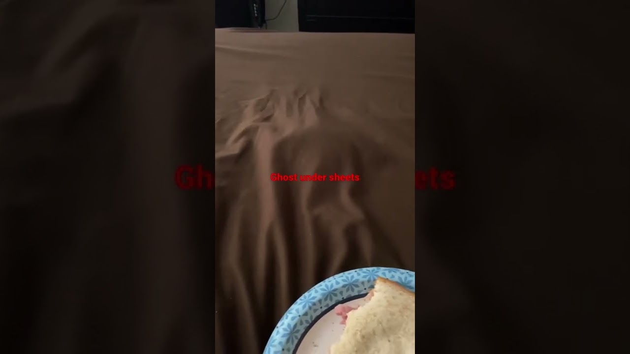 Ghost filmed under sheets. While sitting on bed