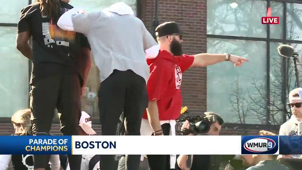 Julian Edelman autographs football tossed by fan