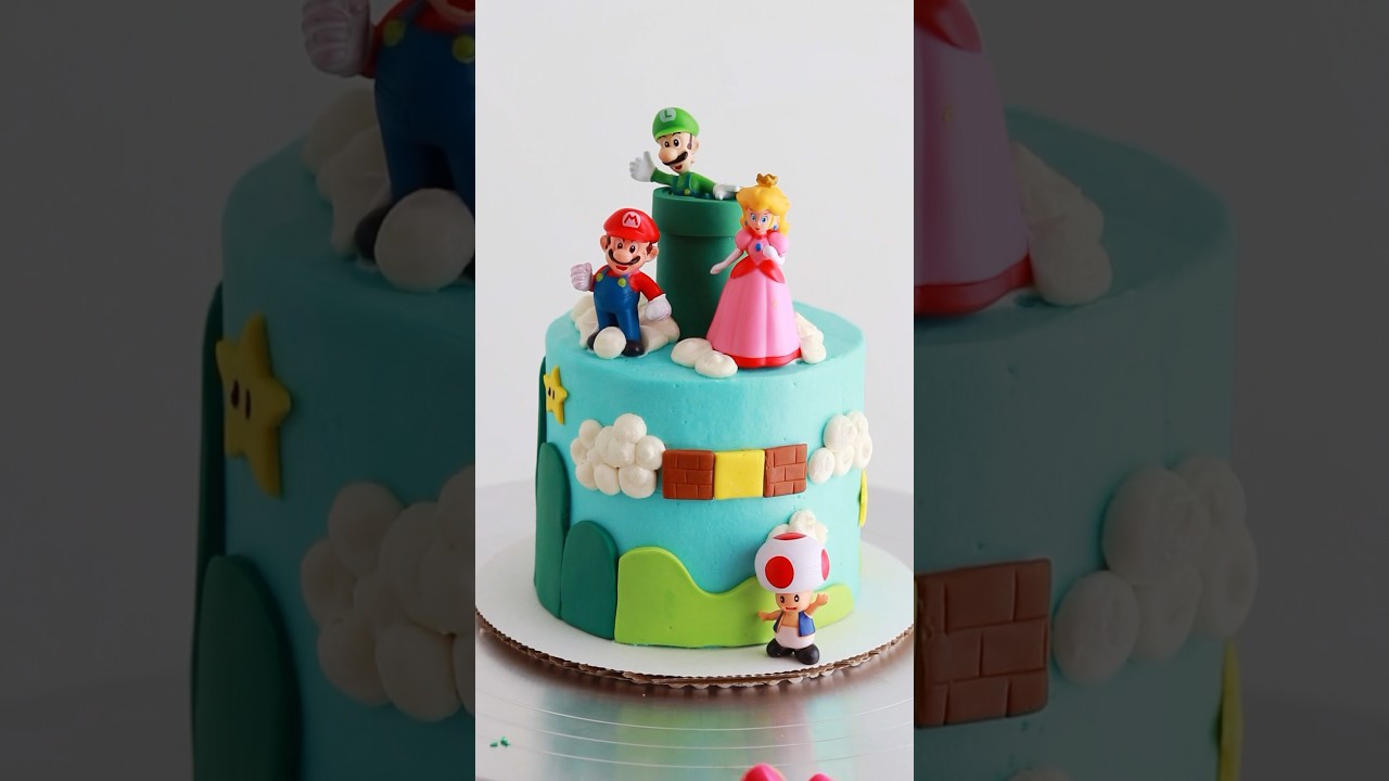 The cutest Super Mario cake with handmade fondant details + toy figurines #birthdaycake #mario #cake