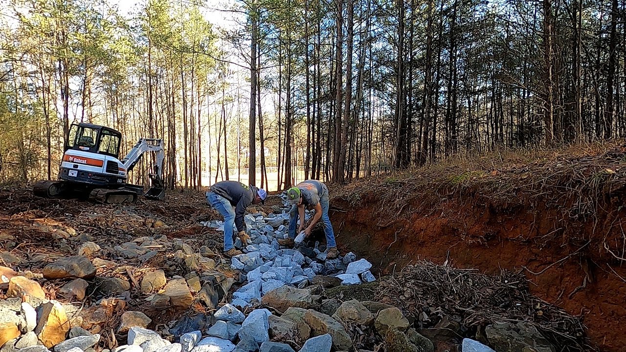 Installing Rip Rap for Drainage Ditch and Erosion Control