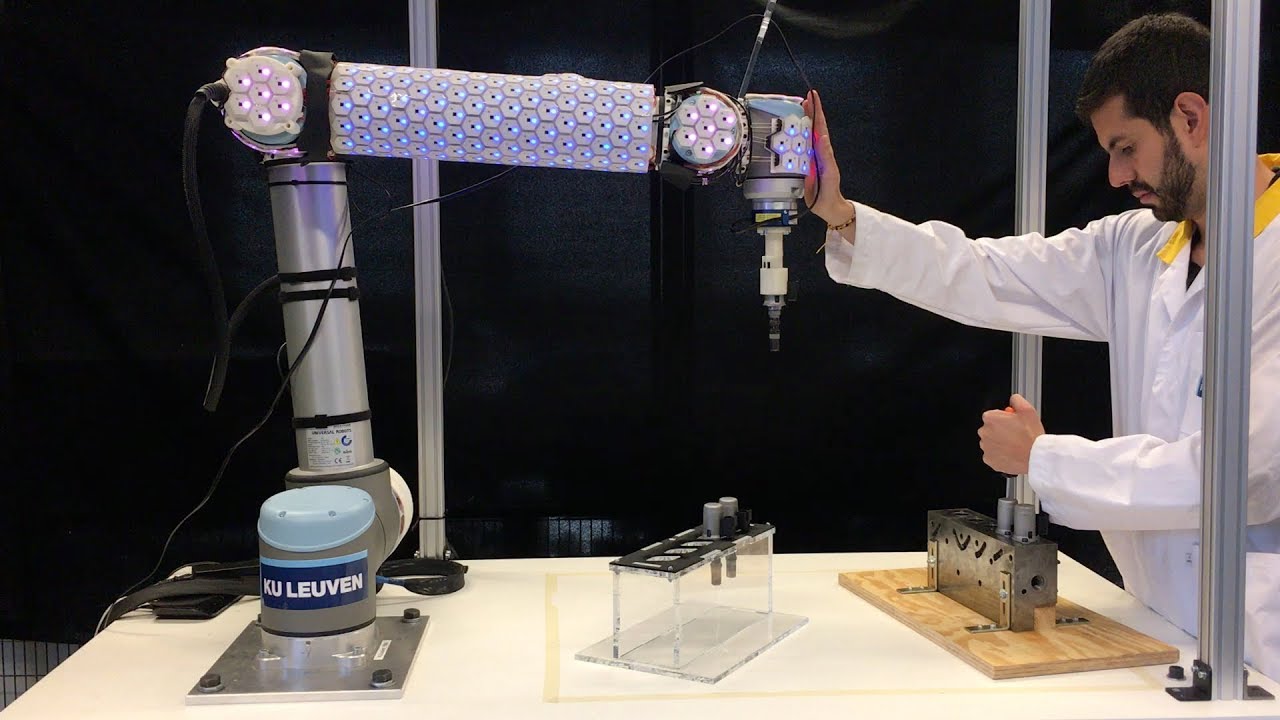 Human-Robot Collaboration Combining Artificial Skin Signals and Constraint-based Reactive Control