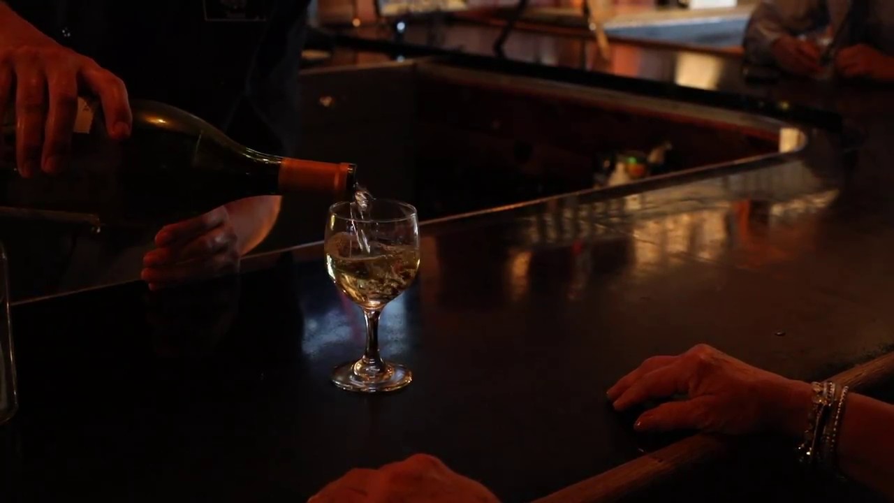 Ordering White Wine at the Bar | Stock Video Pouring White Wine | 59.94fps HD 1080p