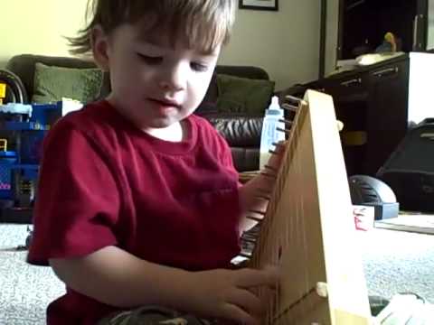 Max Playing the Lap Harp