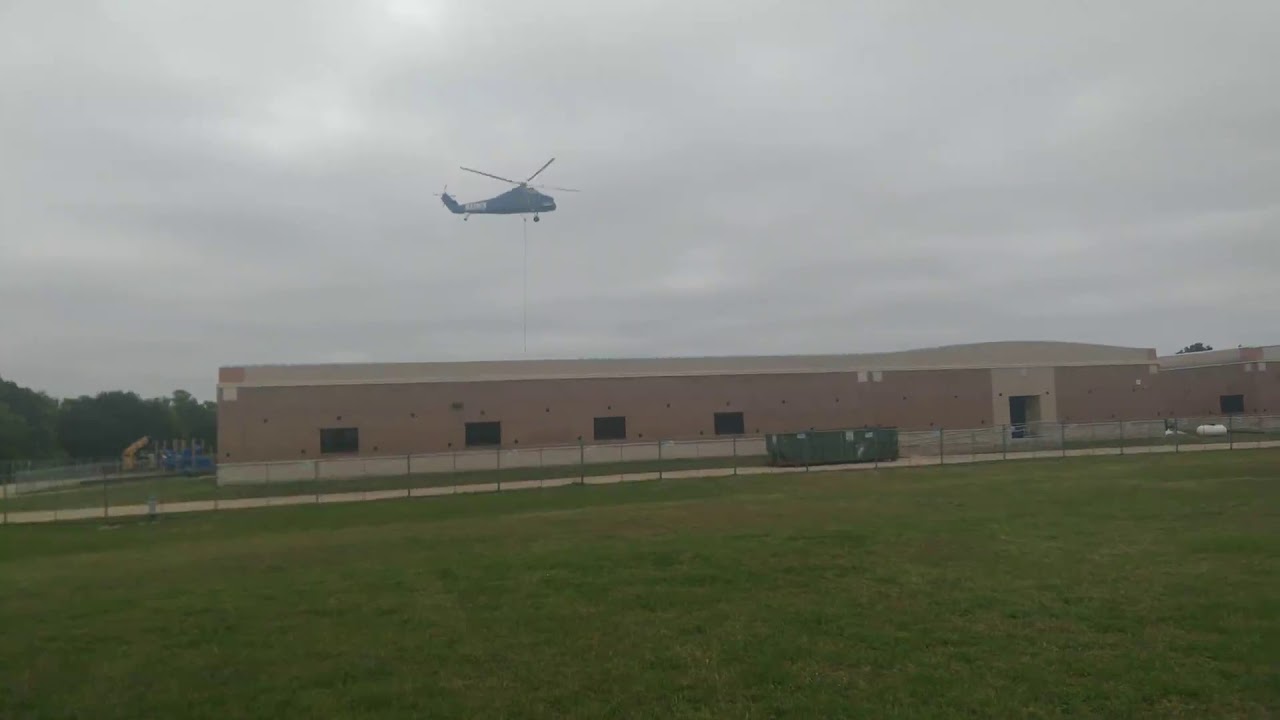 Forest Vista Elementary Fixing Roof by Helicopter